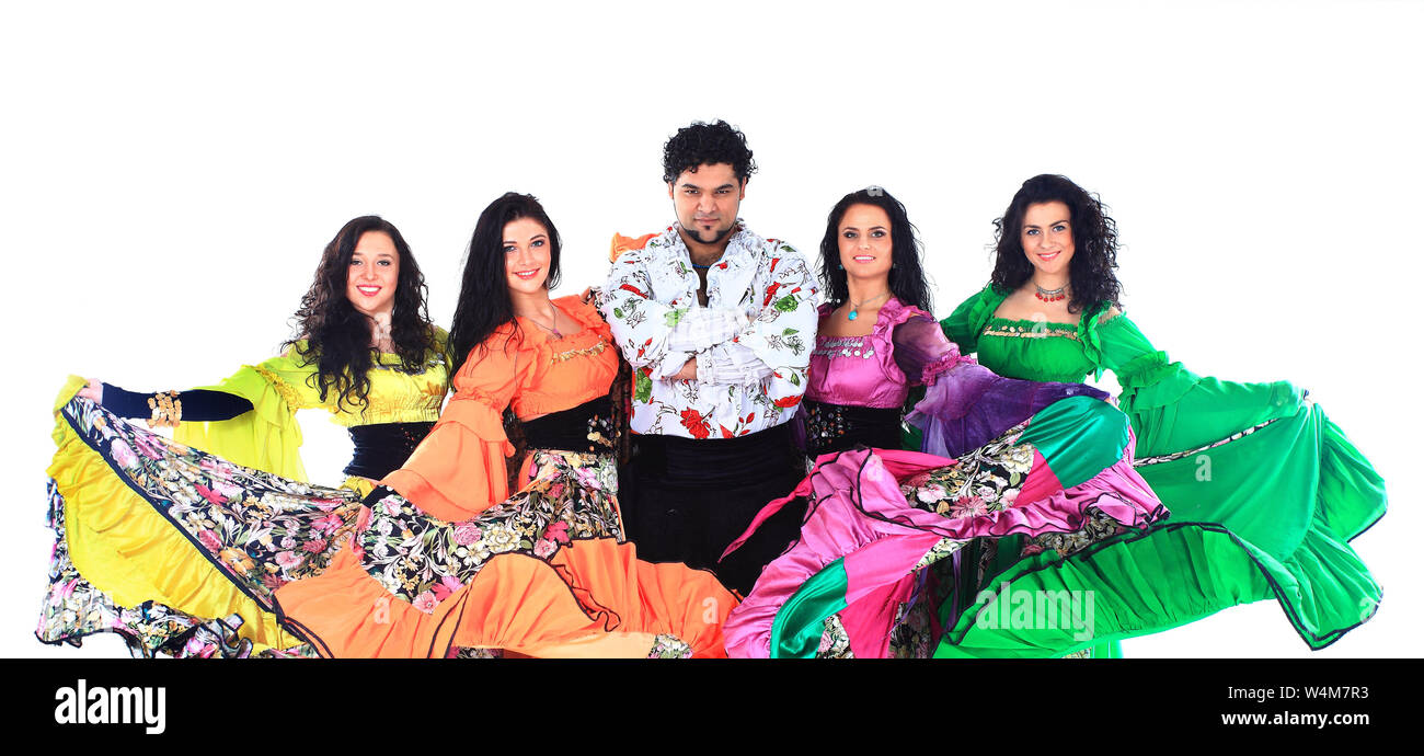 Dance group of gypsies, dancing and waving their magnificent dresses ...