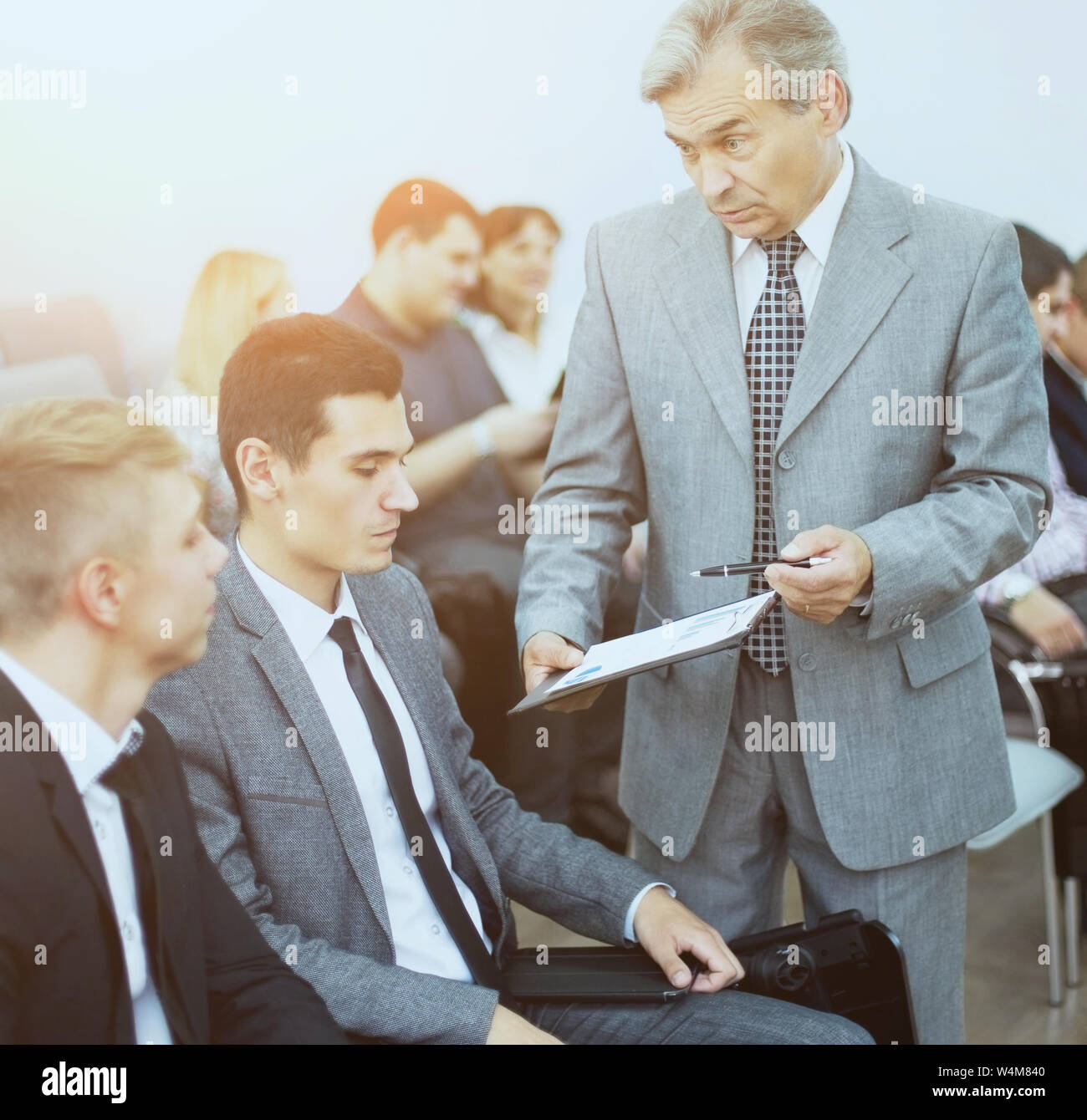 Business meeting - manager discussing work with his colleagues in the ...