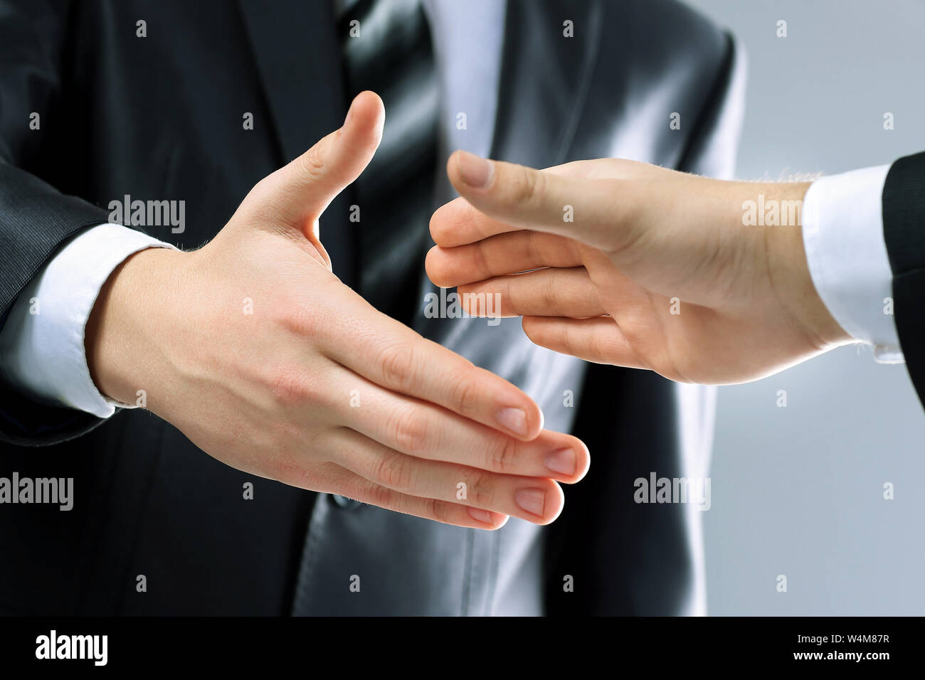 Photo of handshake of business partners after signing promising ...