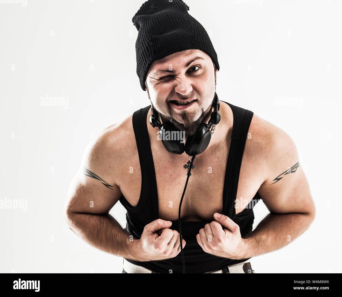 rapper with narrowed eyes with headphones on a white background Stock ...