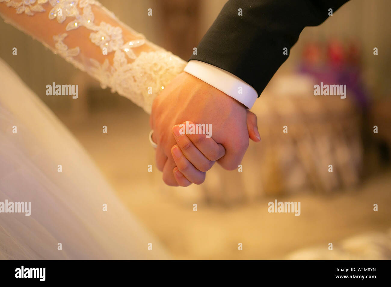 Wedding Couple, Bride and Groom Holding Hands Stock Photo - Alamy