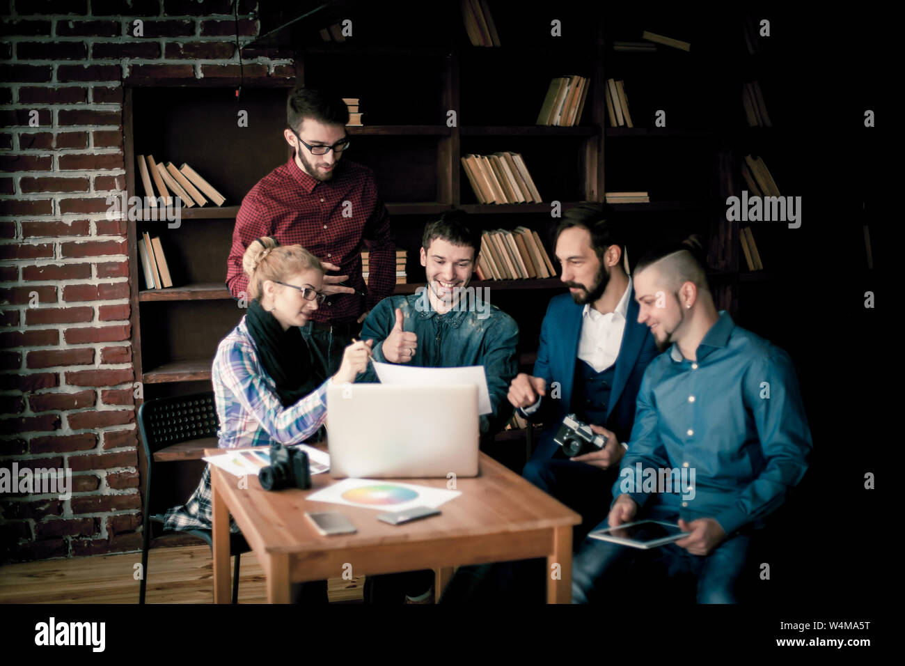 team of copywriters discussing a new advertising project in modern ...