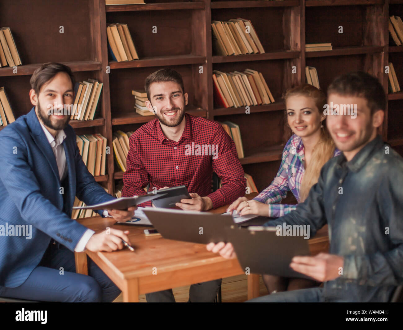 successful business team discussing a financial report on the company's ...