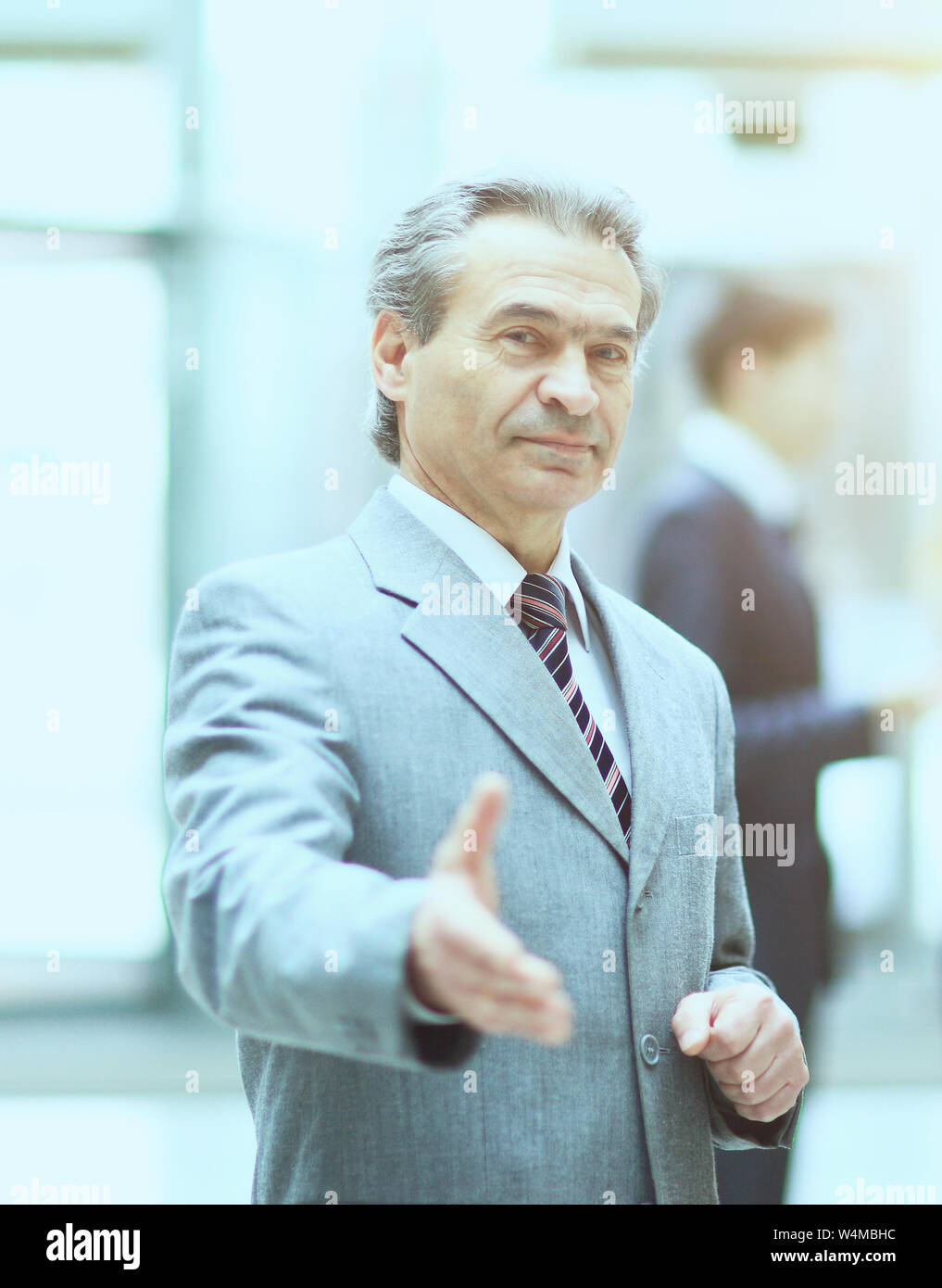 Welcoming business man ready to handshake with hand extended Stock ...