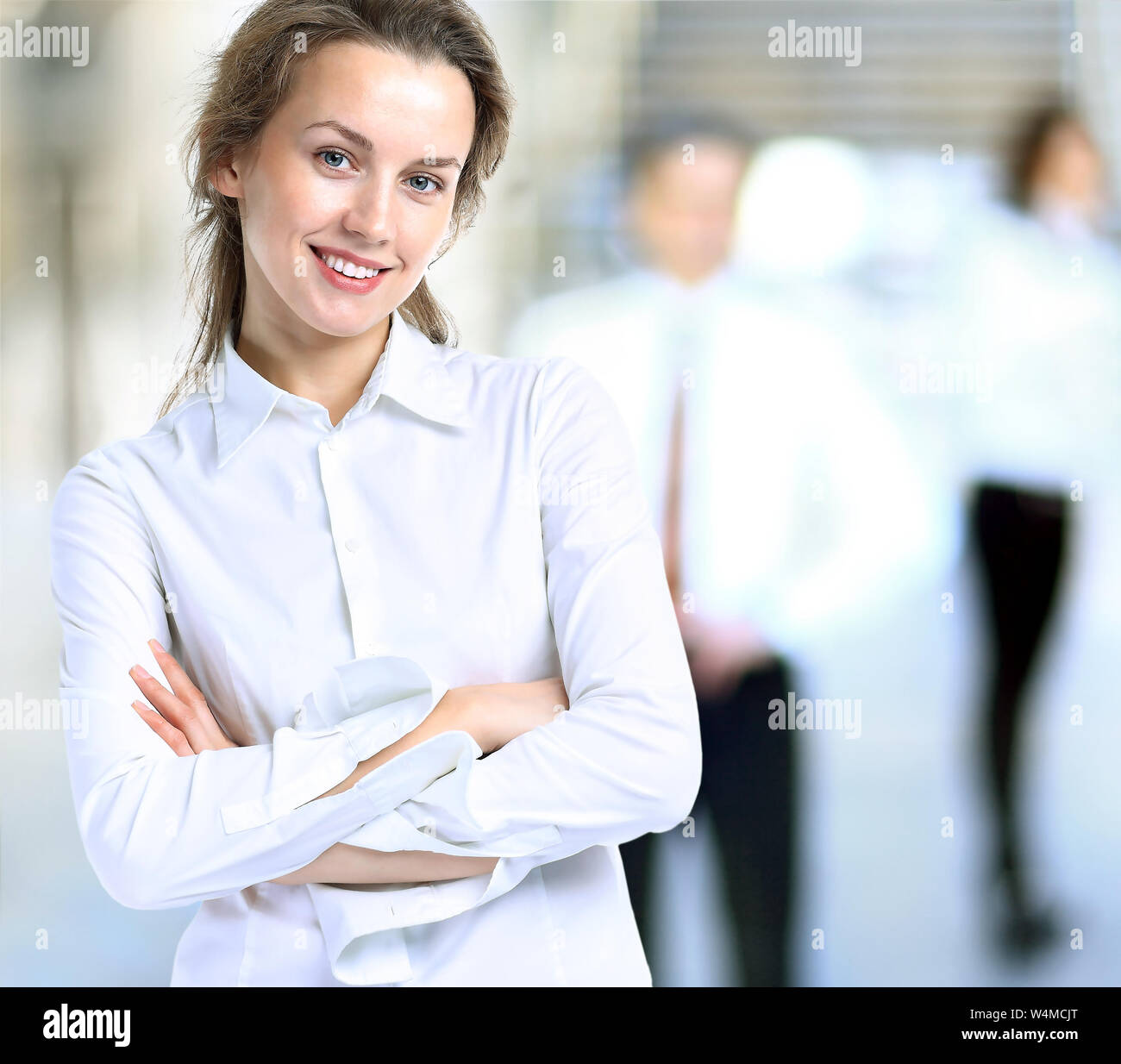 Business lady with positive look and cheerful smile posing for the ...