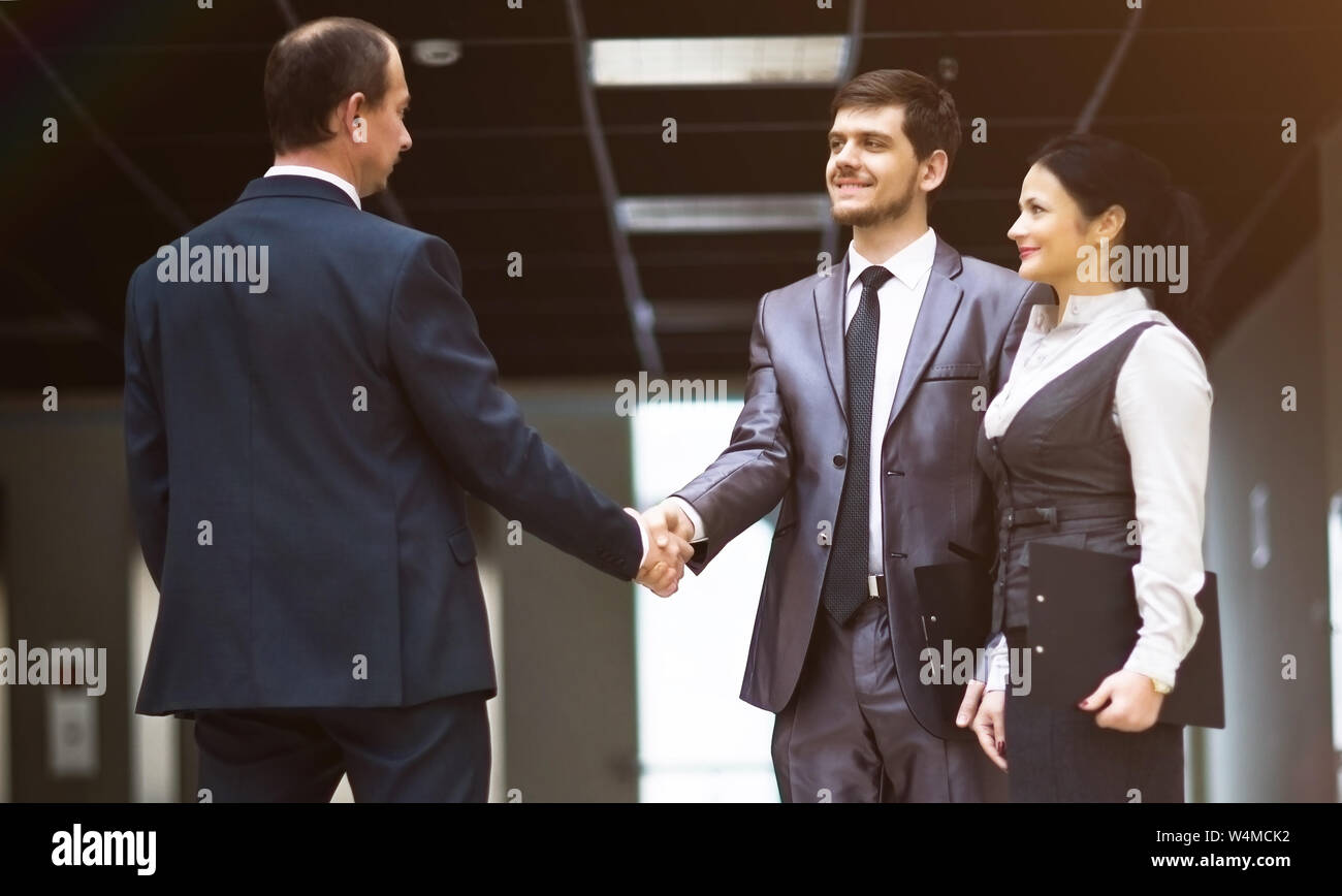 Photo of handshake of business partners after signing promising ...