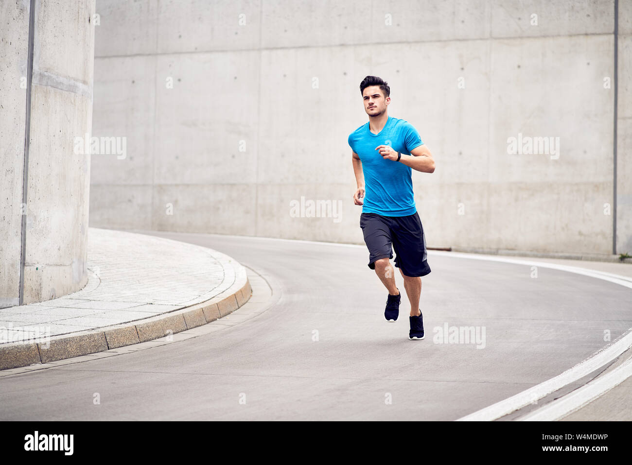 Muscular man jogging city hi-res stock photography and images - Alamy