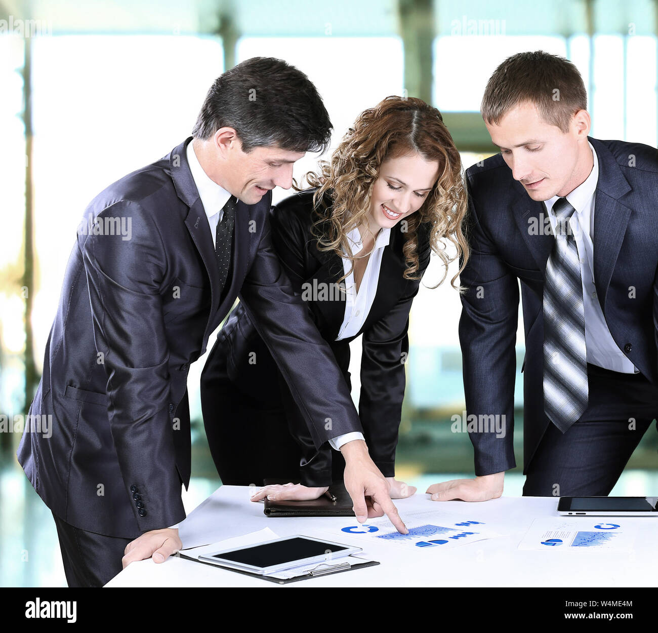 Business team working on their business project together at office ...