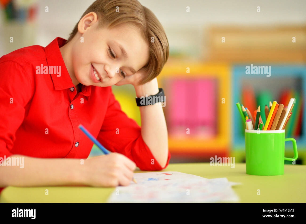 Portrait of cute little boy drawing with pencils at home Stock Photo ...
