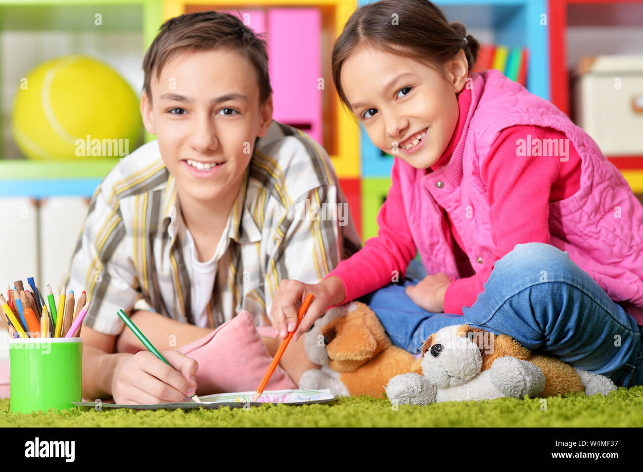 beautiful Brother and sister drawing together at home Stock Photo - Alamy