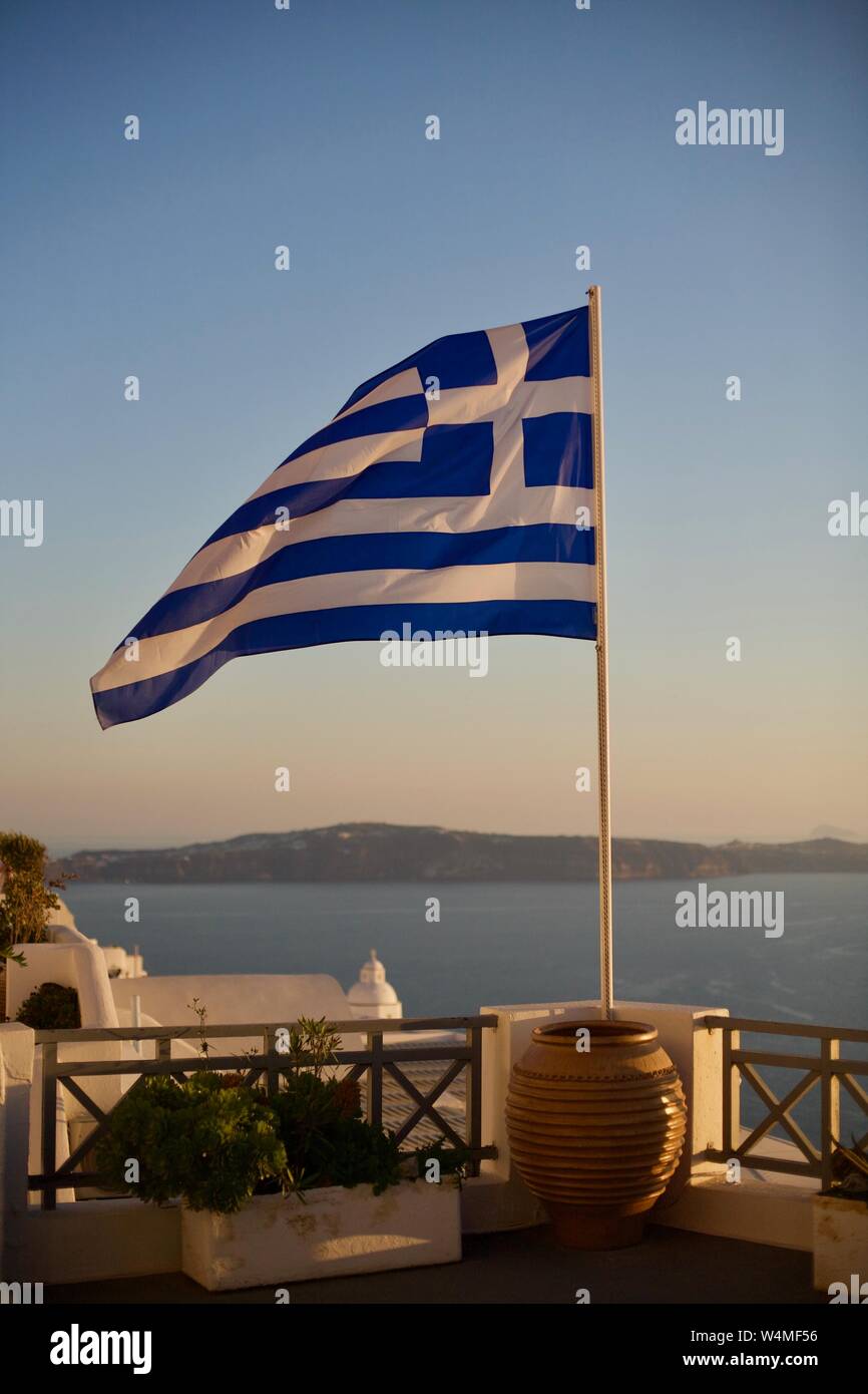 Fluttering Greek Flag on Santorini Island Stock Photo - Alamy