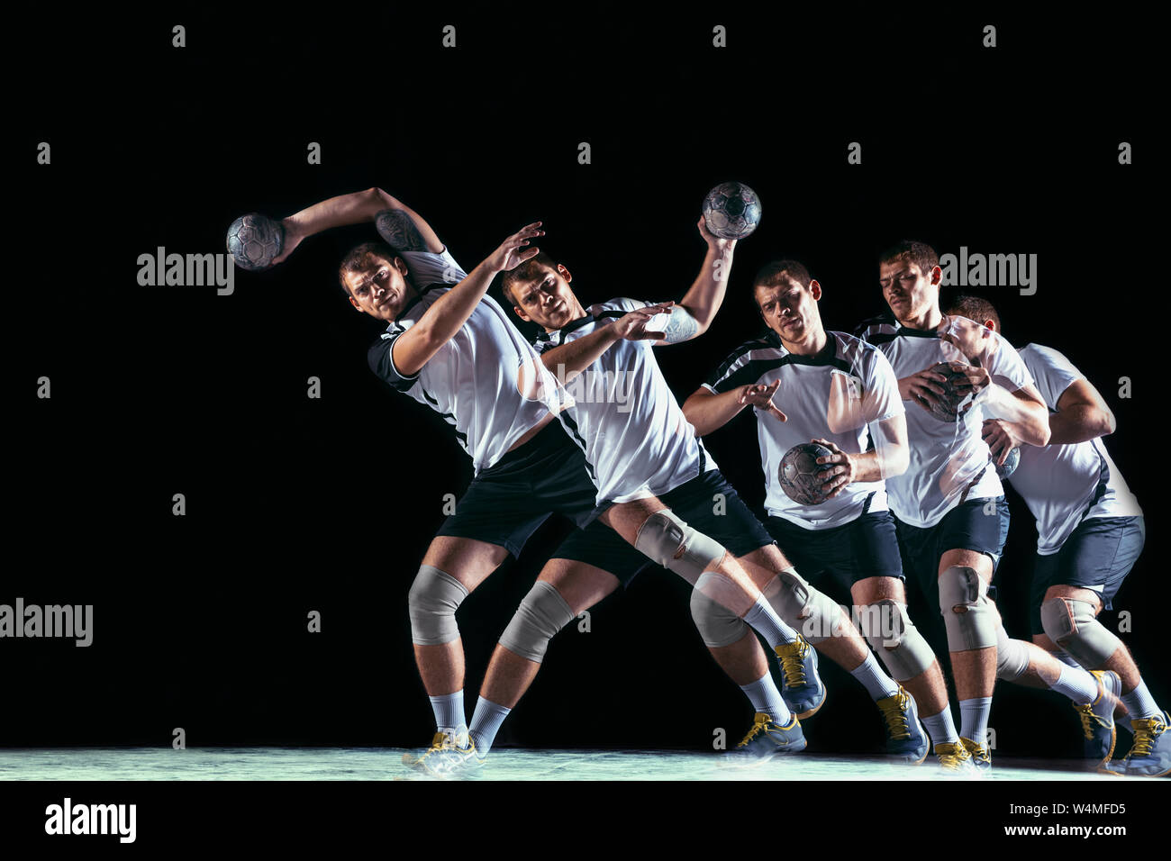 Caucasian young handball player in action and motion in mixed and ...