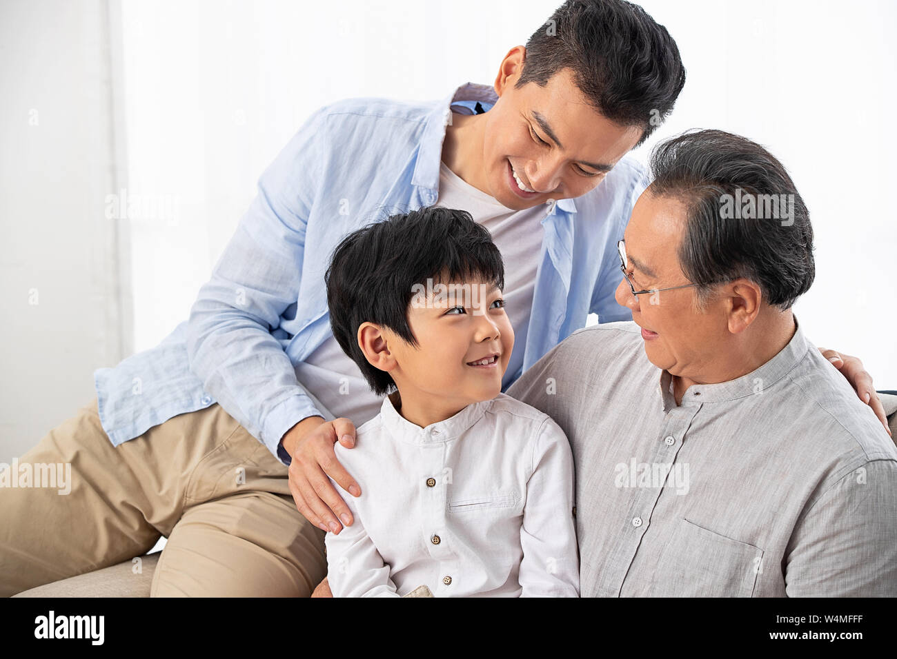 Three generations of a happiness Stock Photo - Alamy