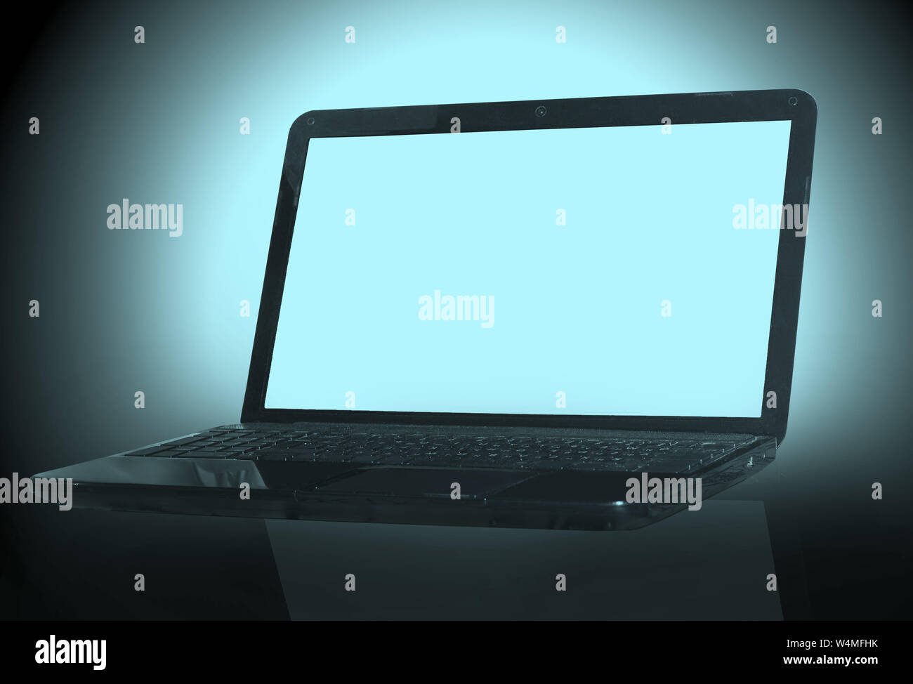 black laptop on black background with reflection Stock Photo - Alamy