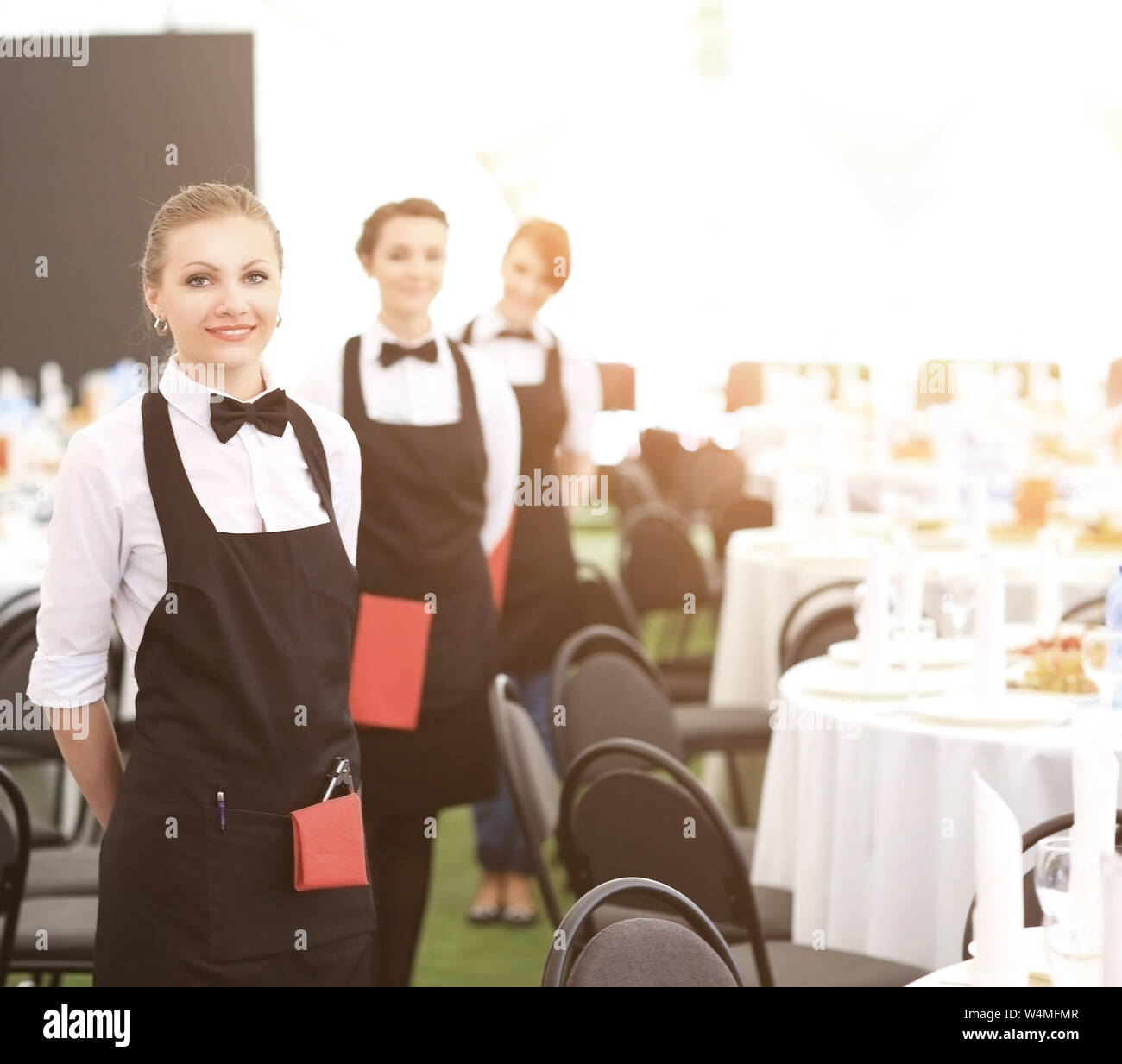A large group of waiters and waitresses next served tables Stock Photo ...