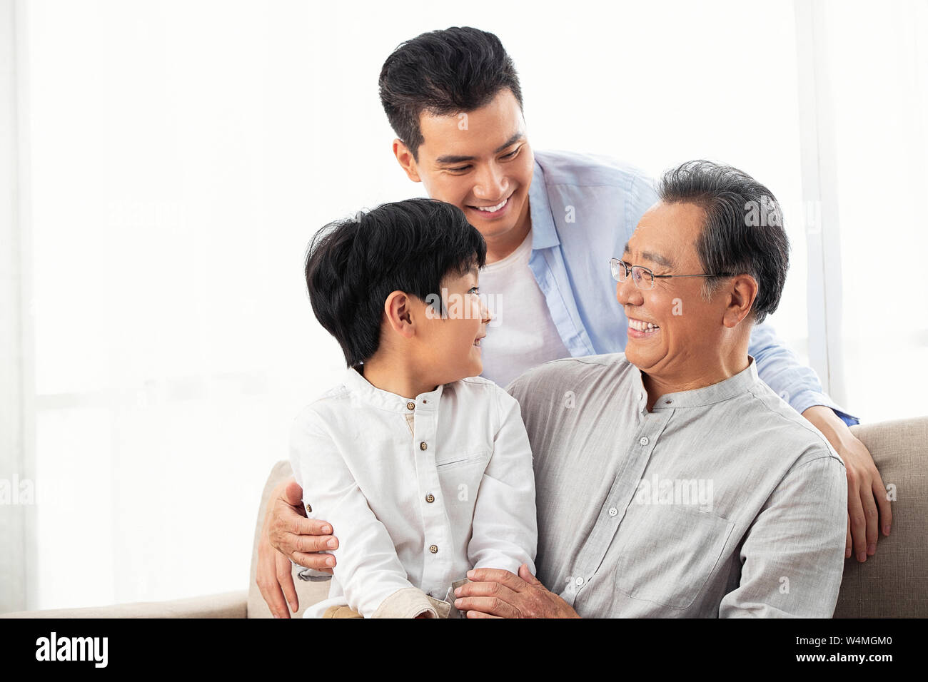 Three generations of a happiness Stock Photo - Alamy
