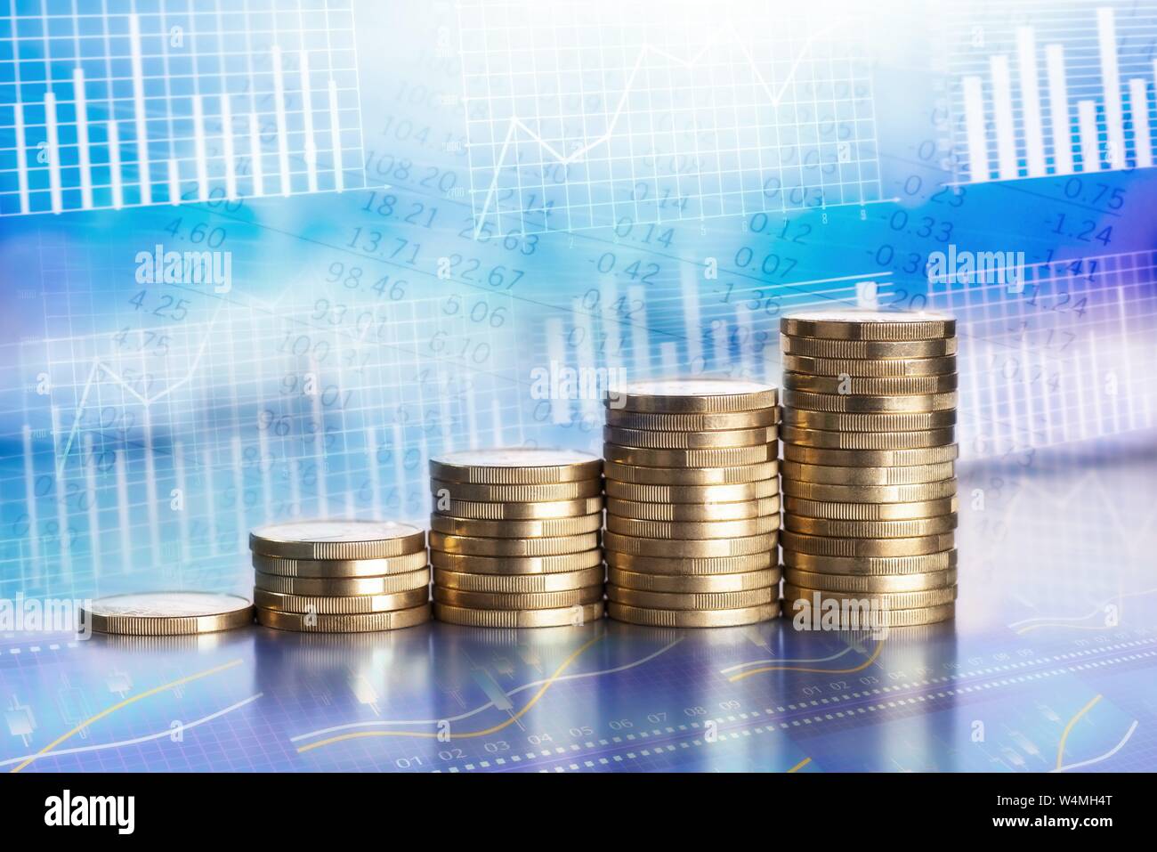 Rising stacks of coins and graphs and charts in the background | usage ...