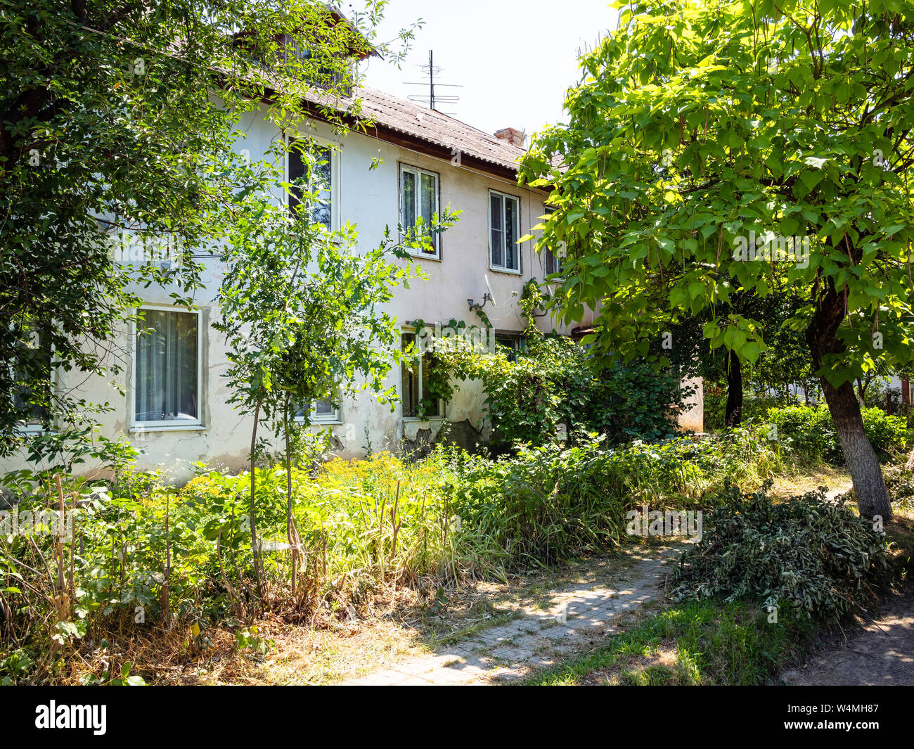 travel to Kuban region of Russia - old shabby two-storey municipal ...
