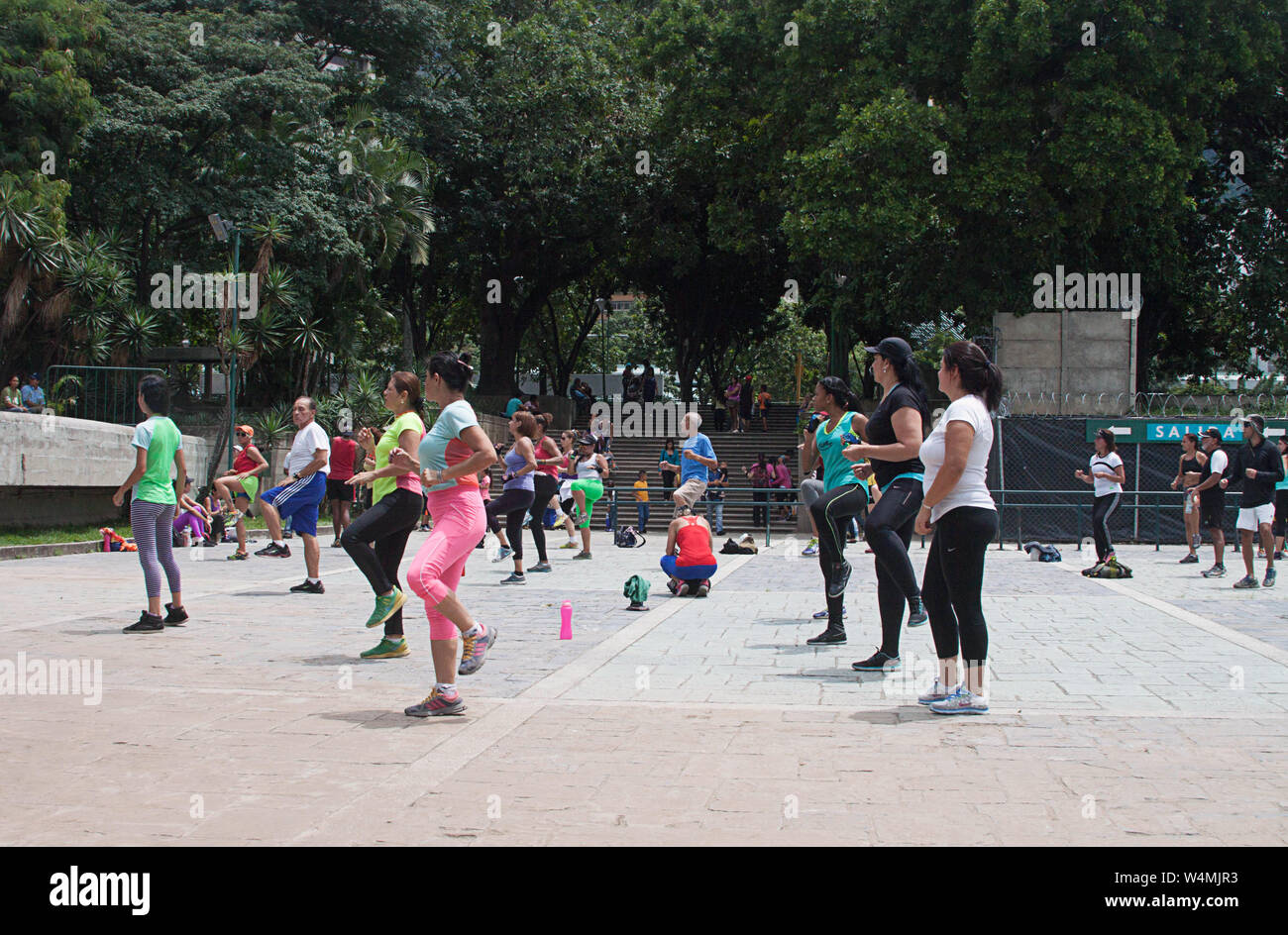 People exercising outdoors in Caracas during the weekend. Summer ...