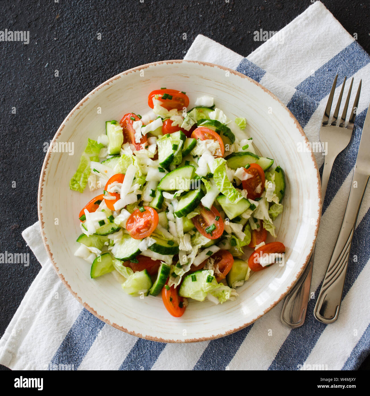 Healthy vegetable salad of fresh tomato, cucumber, peking cabbage and ...