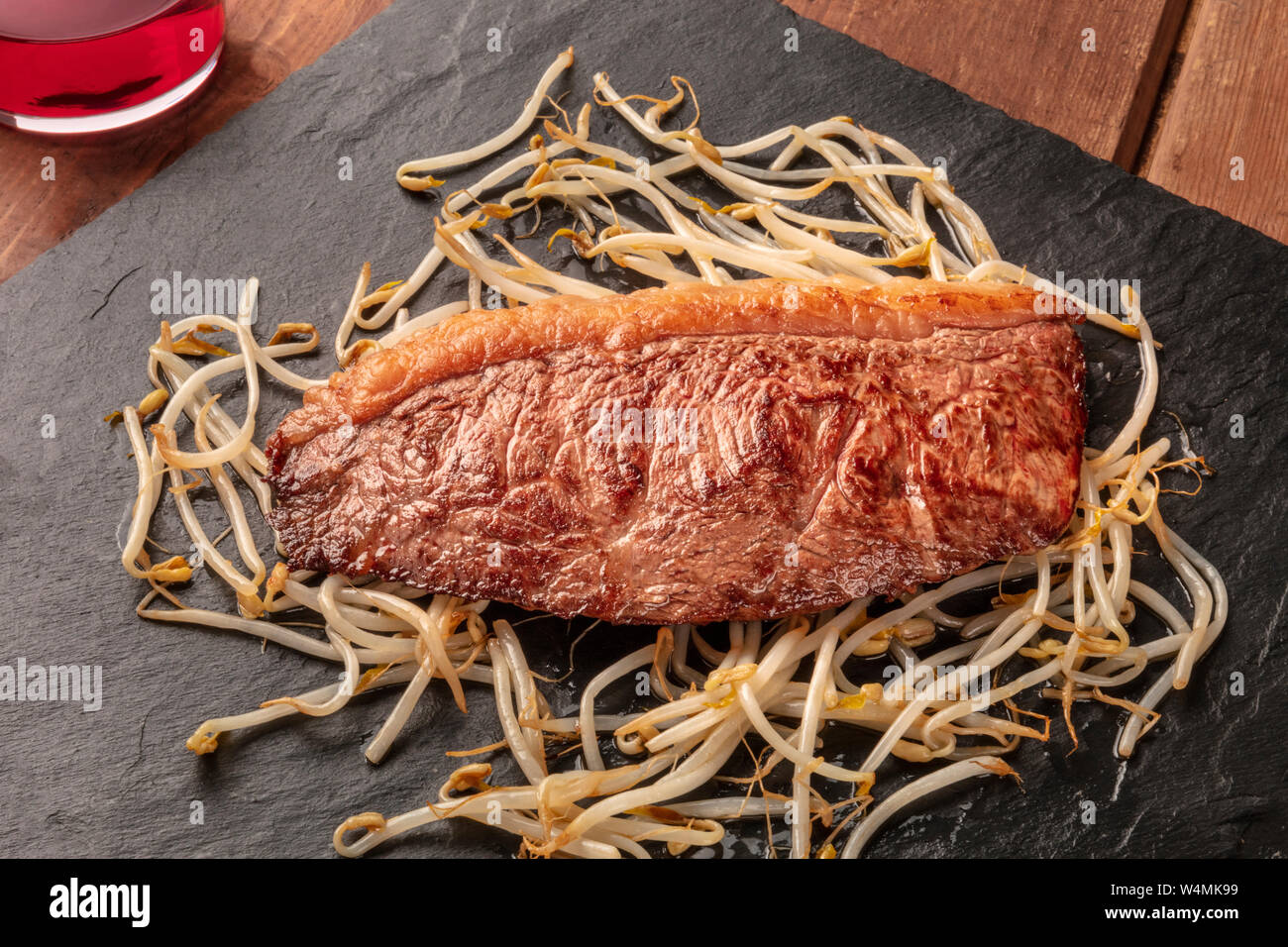 Kobe meat, wagyu beef steak, cooked, with soy sprouts and red wine ...