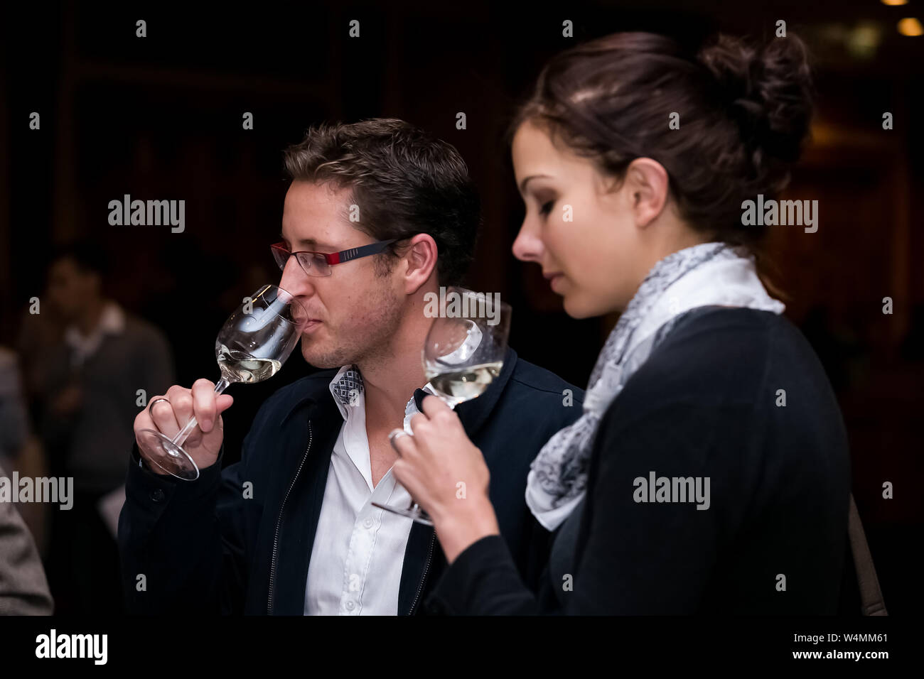 Johannesburg, South Africa - May 10 2013: Sophisticated people sampling ...