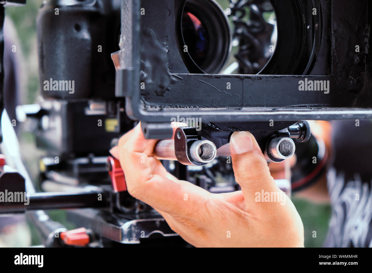 Film industry. cameraman shooting film scene with camera Stock Photo ...