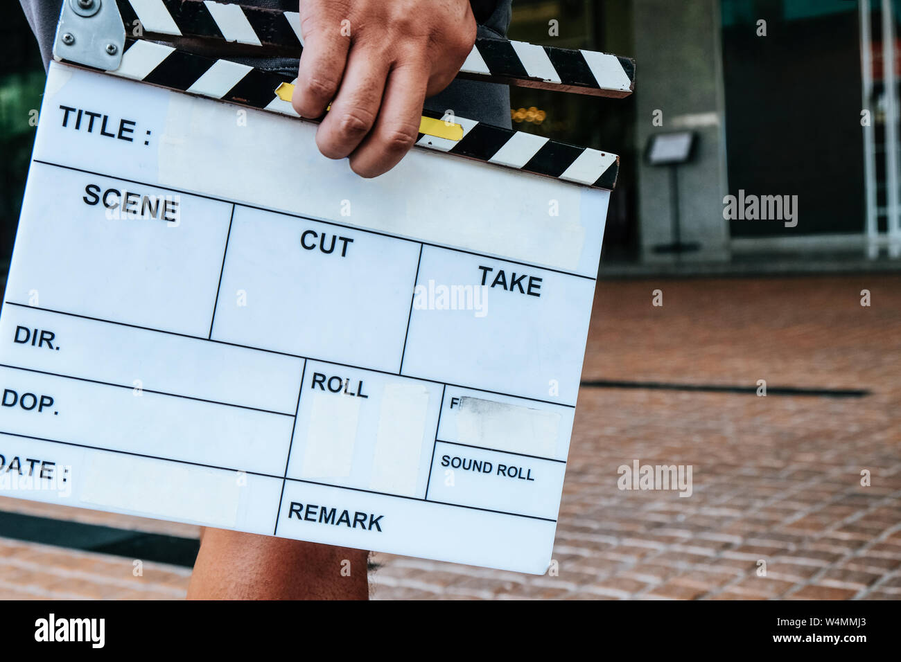 Filming crew,Man hands holding movie clapper Stock Photo - Alamy