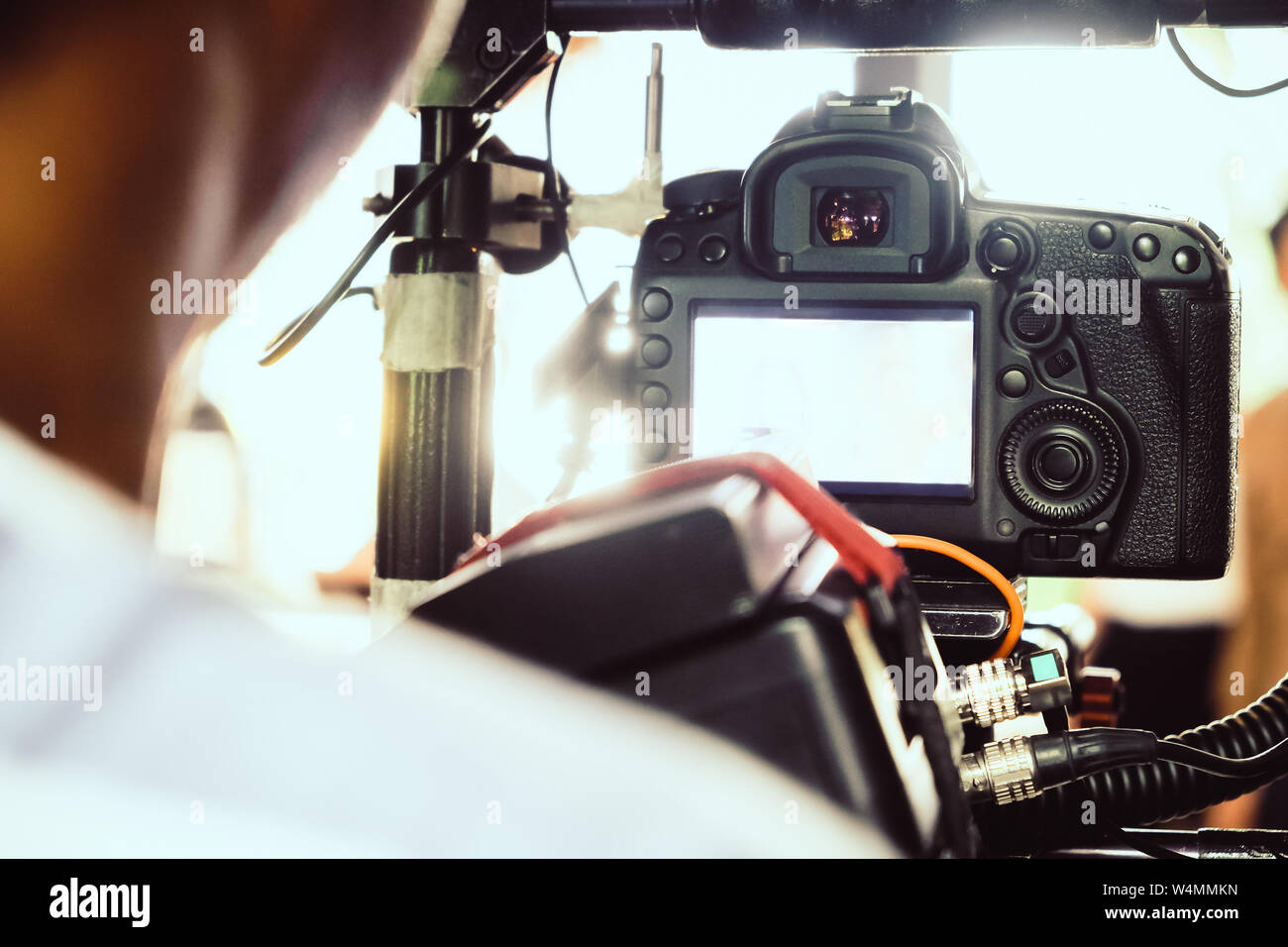 Film industry. cameraman shooting film scene with camera Stock Photo ...