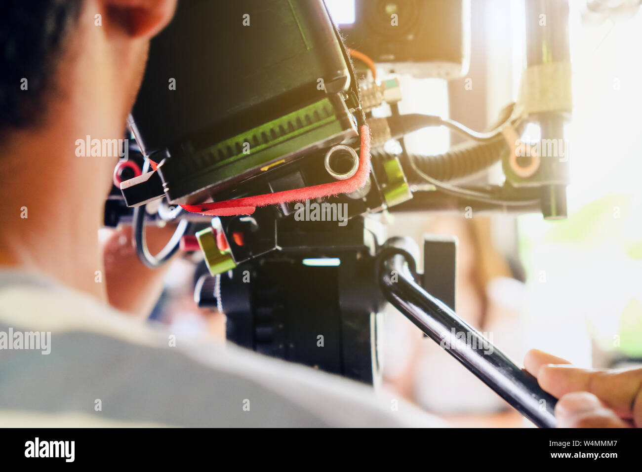 Film industry. cameraman shooting film scene with camera Stock Photo ...