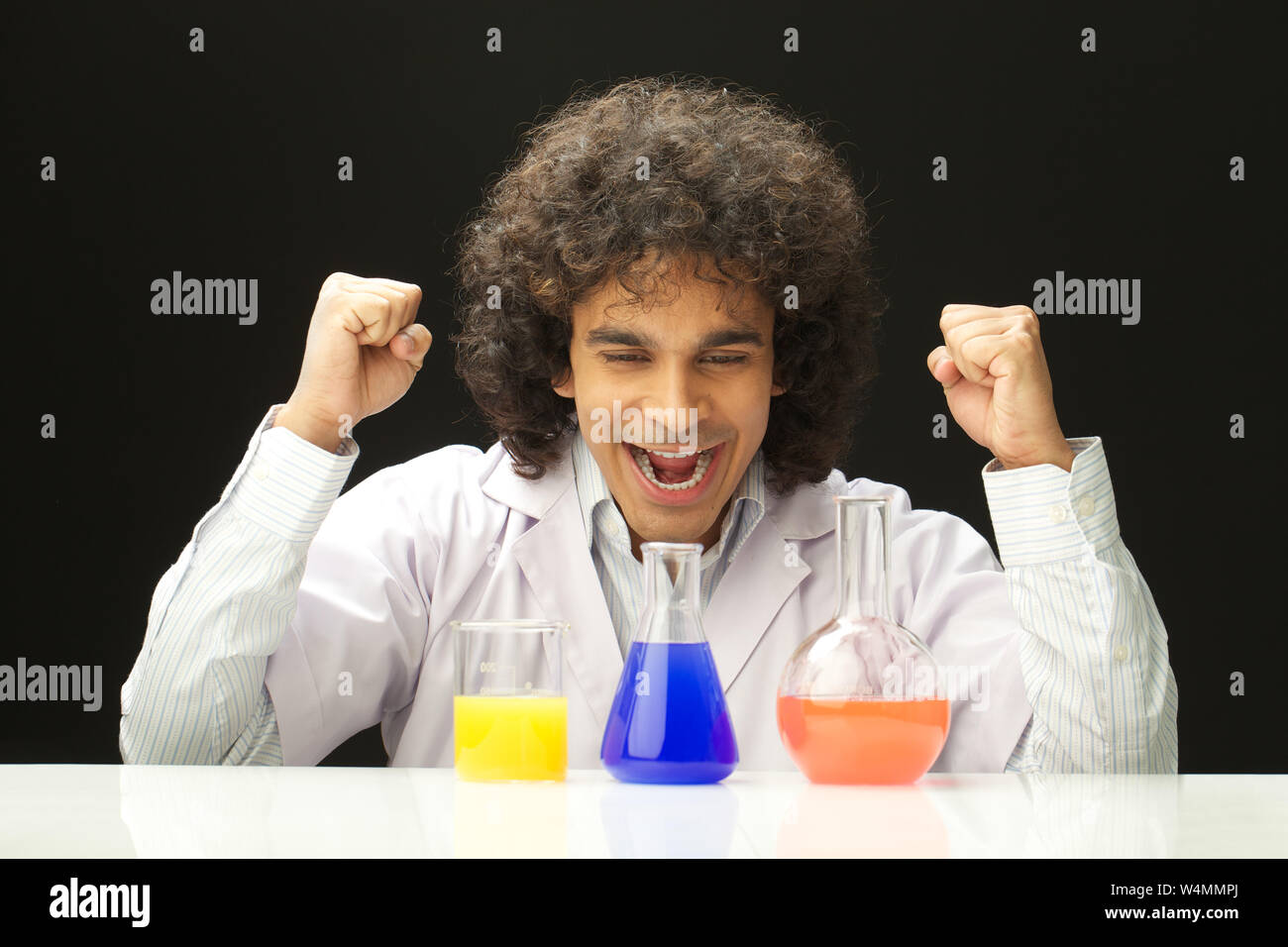 Scientist celebrating his success Stock Photo - Alamy