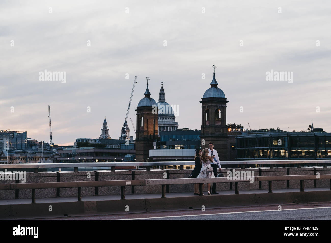 London, UK - June 22, 2019: People in evening wear standing and talking ...