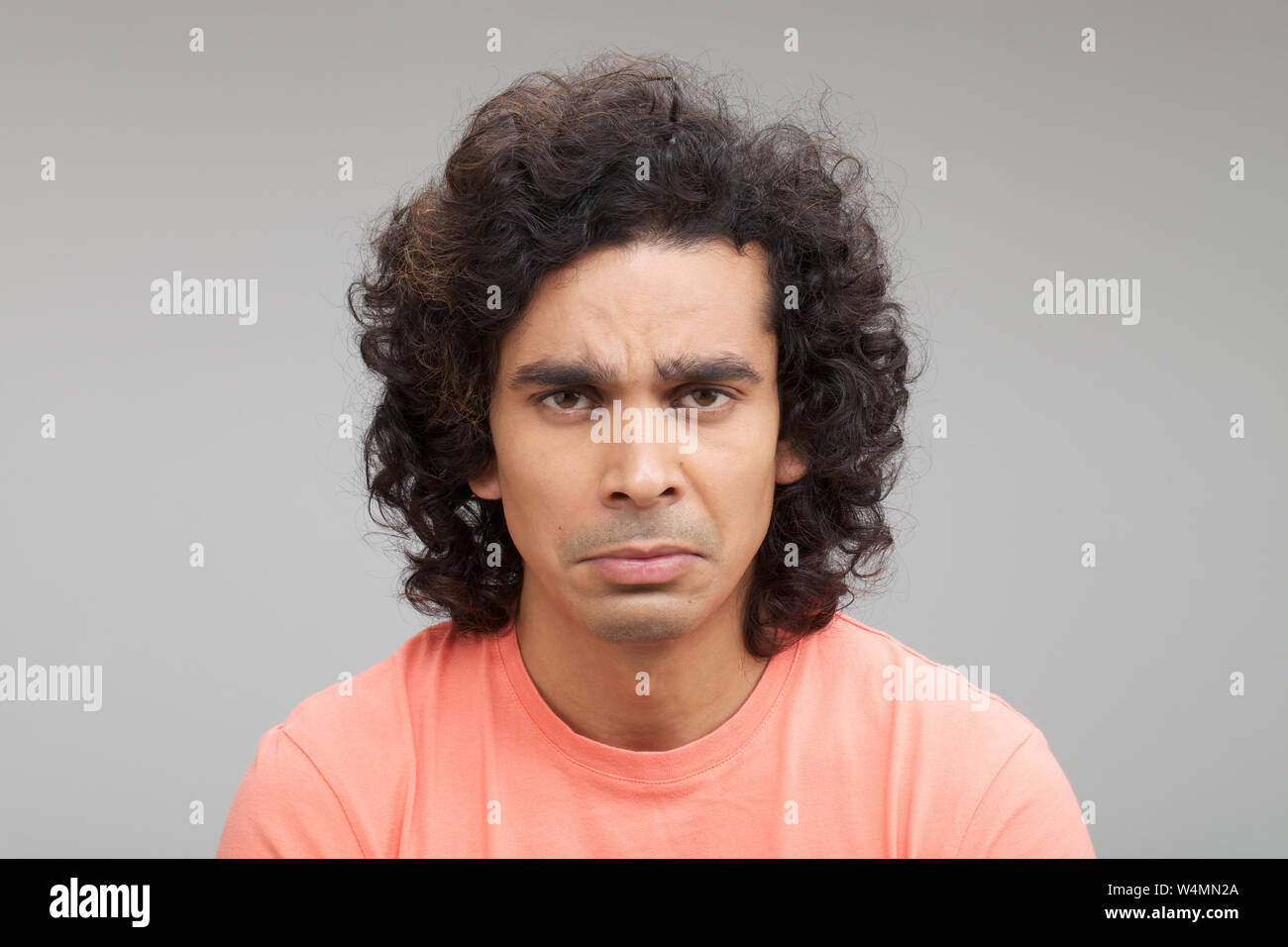 Portrait of an Indian man sulking Stock Photo - Alamy