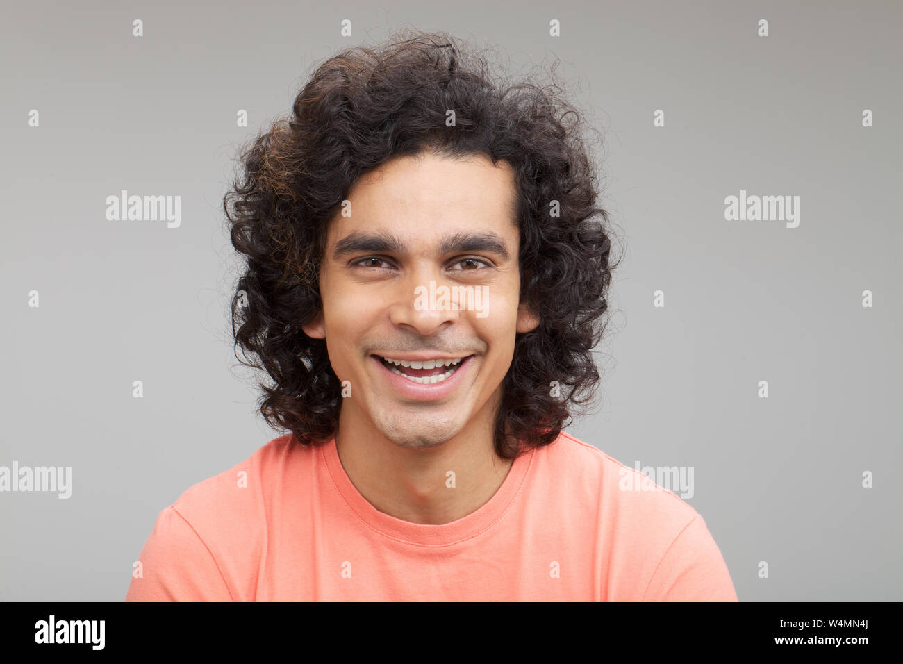 Portrait of an Indian young man smiling Stock Photo - Alamy