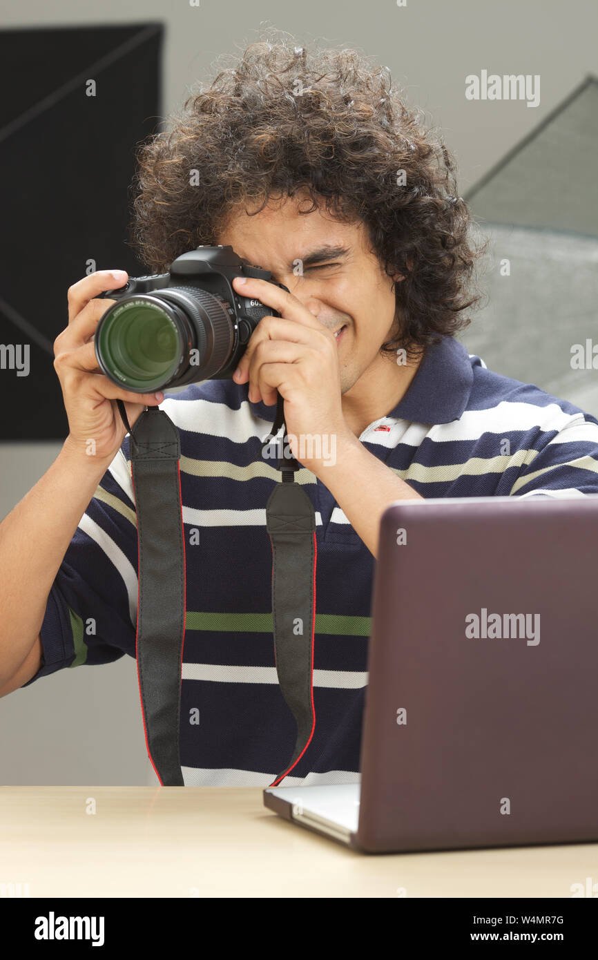 Photographer using camera Stock Photo - Alamy