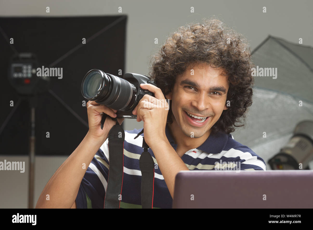 Photographer using camera Stock Photo - Alamy