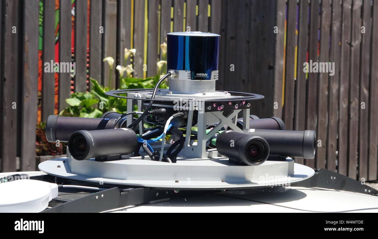 Close-up of Lidar and other sensor hardware mounted on top of an ...