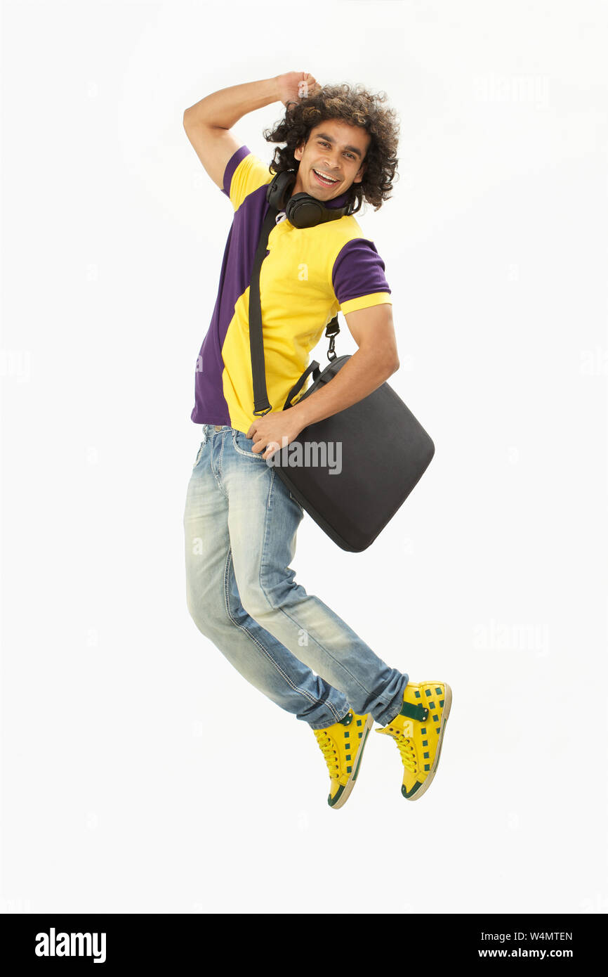 College student jumping in air Stock Photo - Alamy