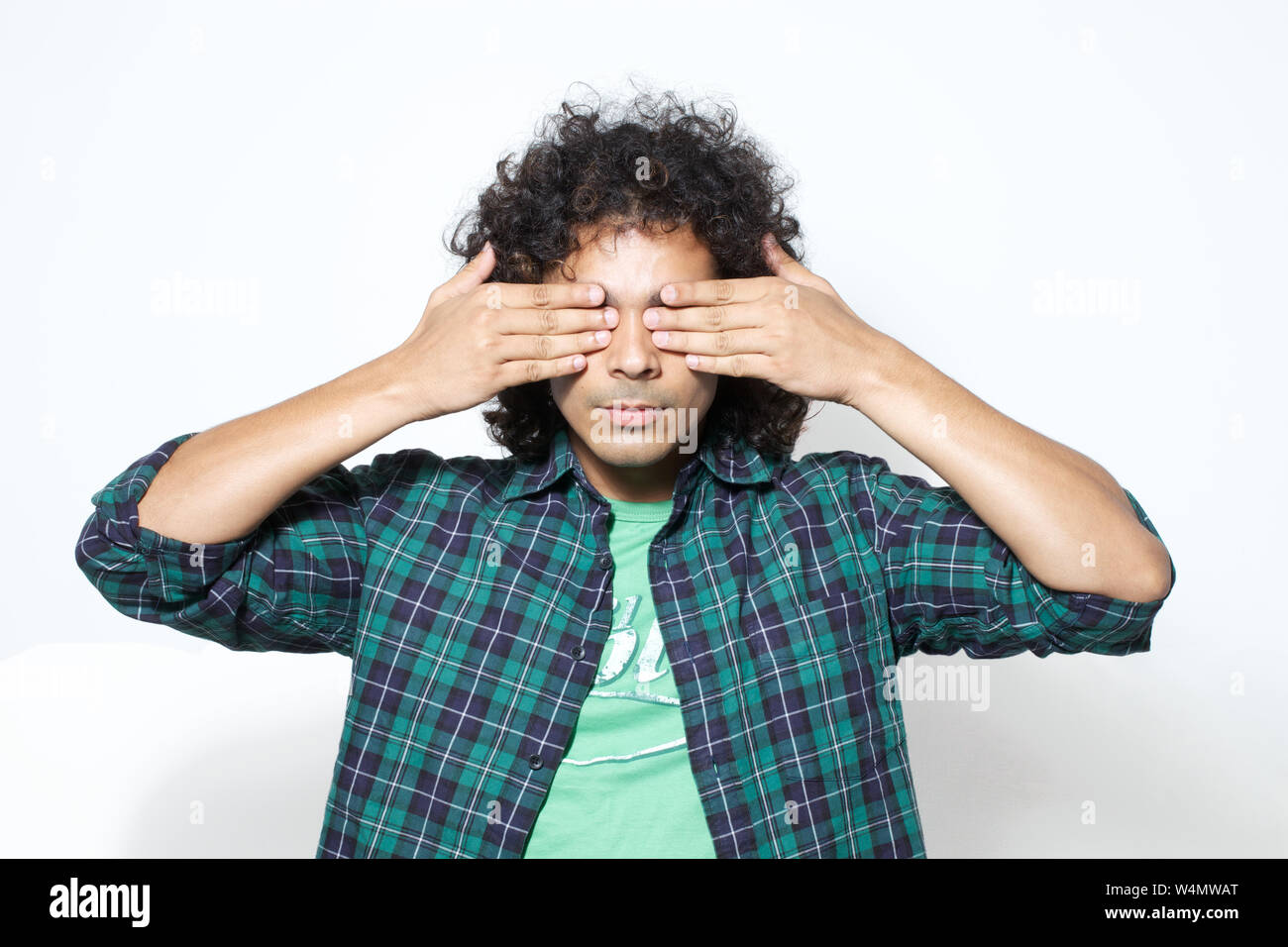 Man covering eyes with hands Stock Photo - Alamy
