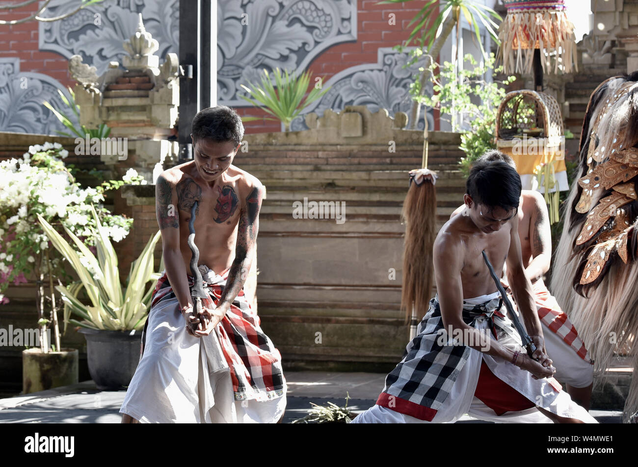 Bali, Indonesia - may 24, 2017: Balinese Debus player slicing the body ...