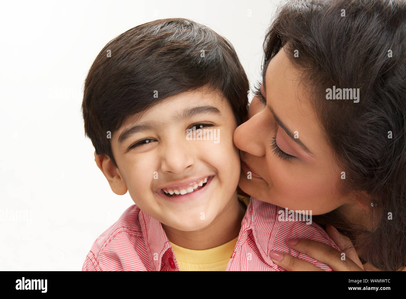 Boy kissing on cheek woman hi-res stock photography and images - Alamy