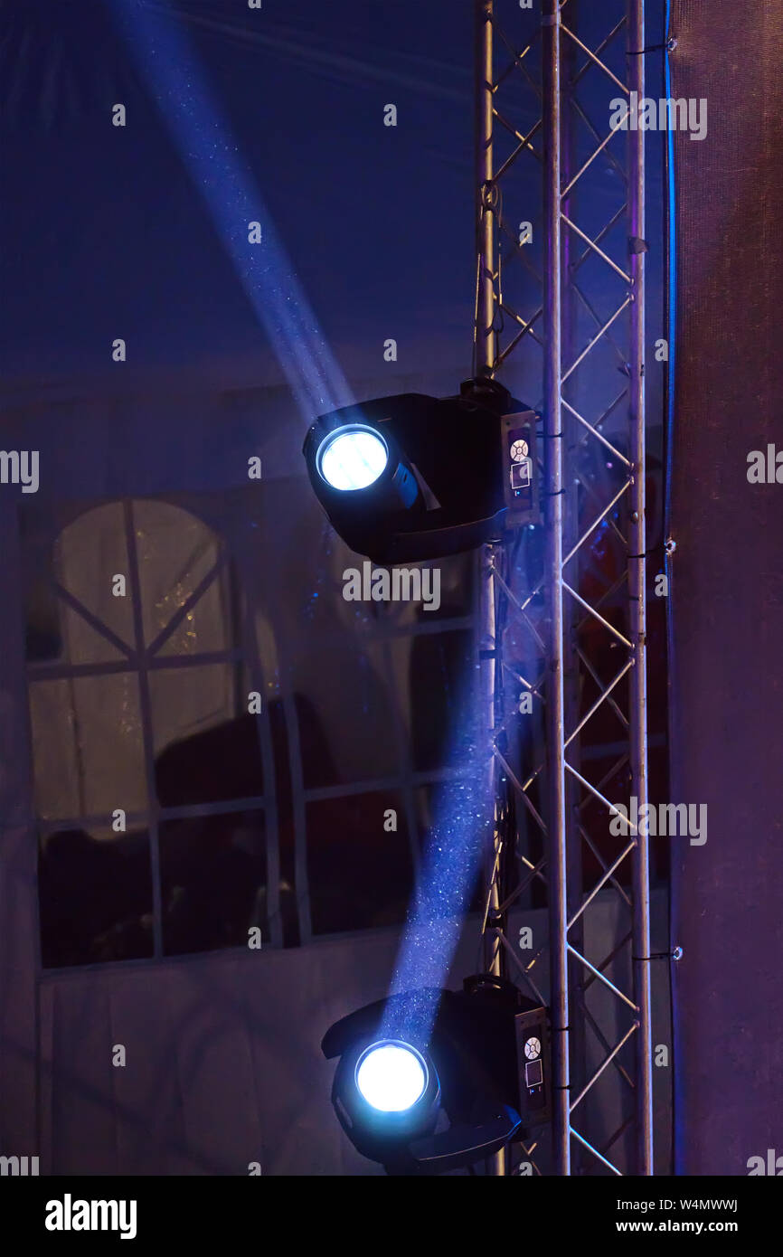 Lighting spotlights on stage during performance with colorful rays of ...