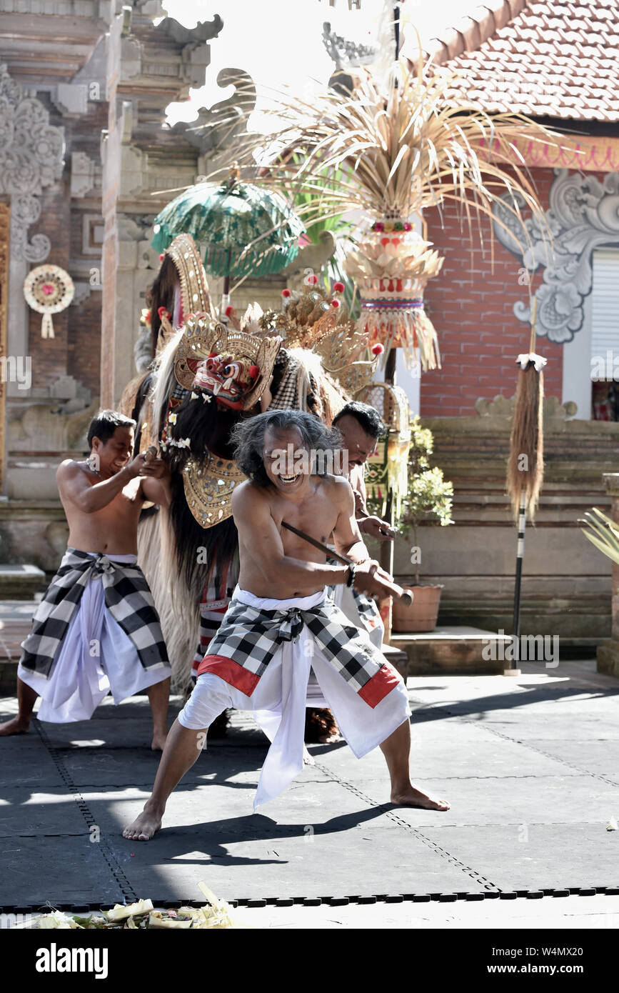Bali, Indonesia - may 24, 2017: Balinese Debus player slicing the body ...