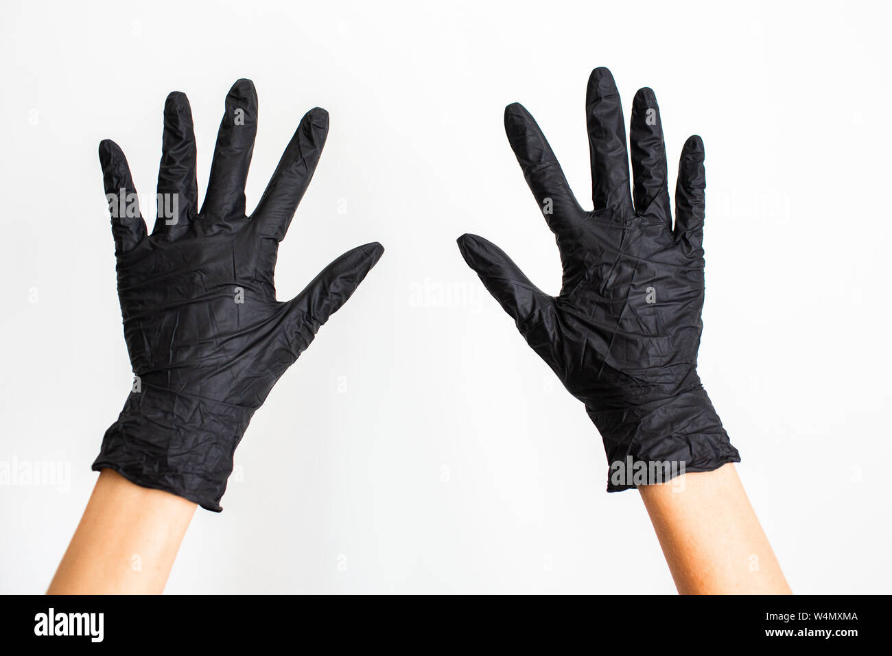 Gloved hand black hi-res stock photography and images - Alamy