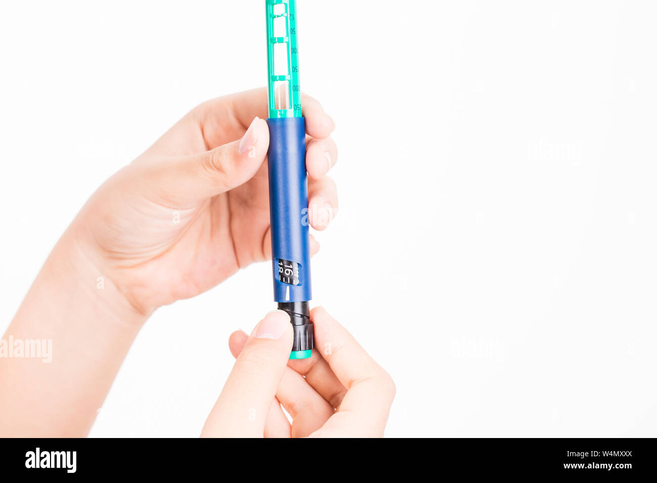hand holding in sulin pen on white background Stock Photo - Alamy