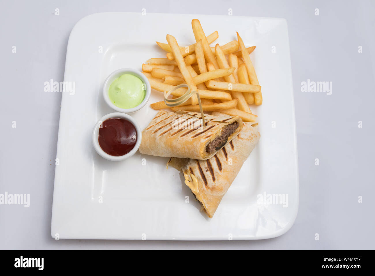 A low contrast Hero shot of a beef wrap sandwich with samurai & alger ...