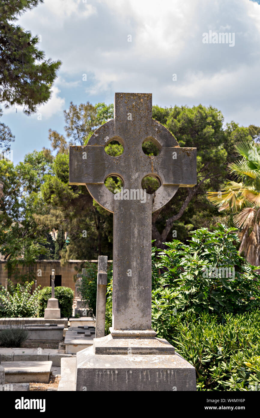 Old tombstone with Celtic cross an ancient war cemetery, Malta Stock ...