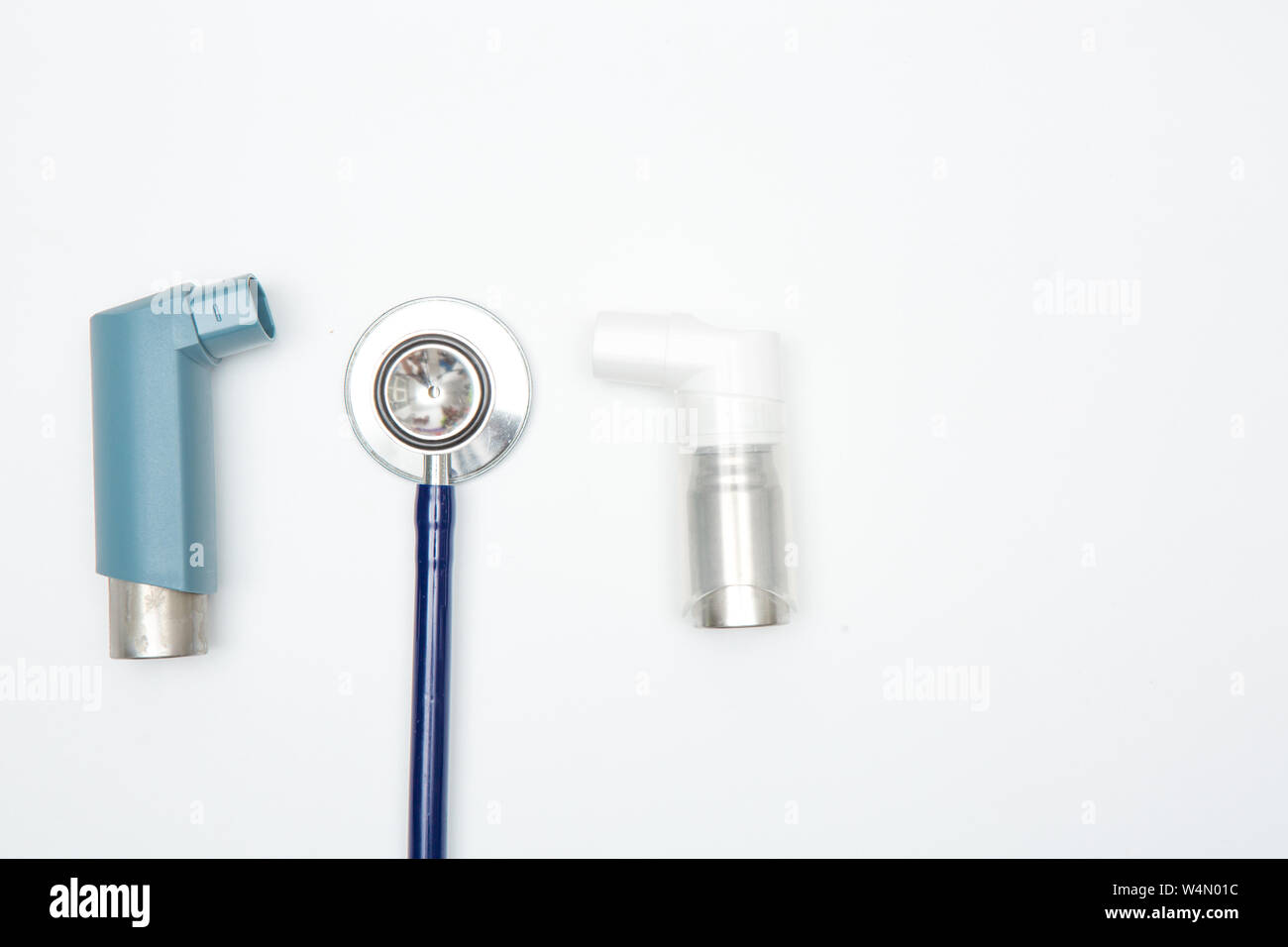 respiratory inhaler and stethoscope on white background Stock Photo - Alamy