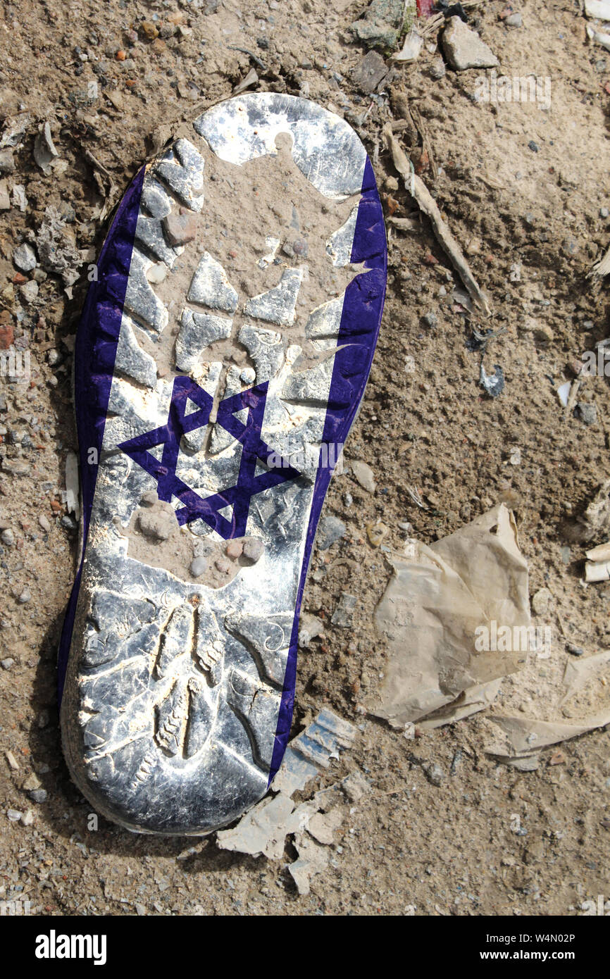 The flag of Israel is depicted on the sole of an old boot. Ecology ...