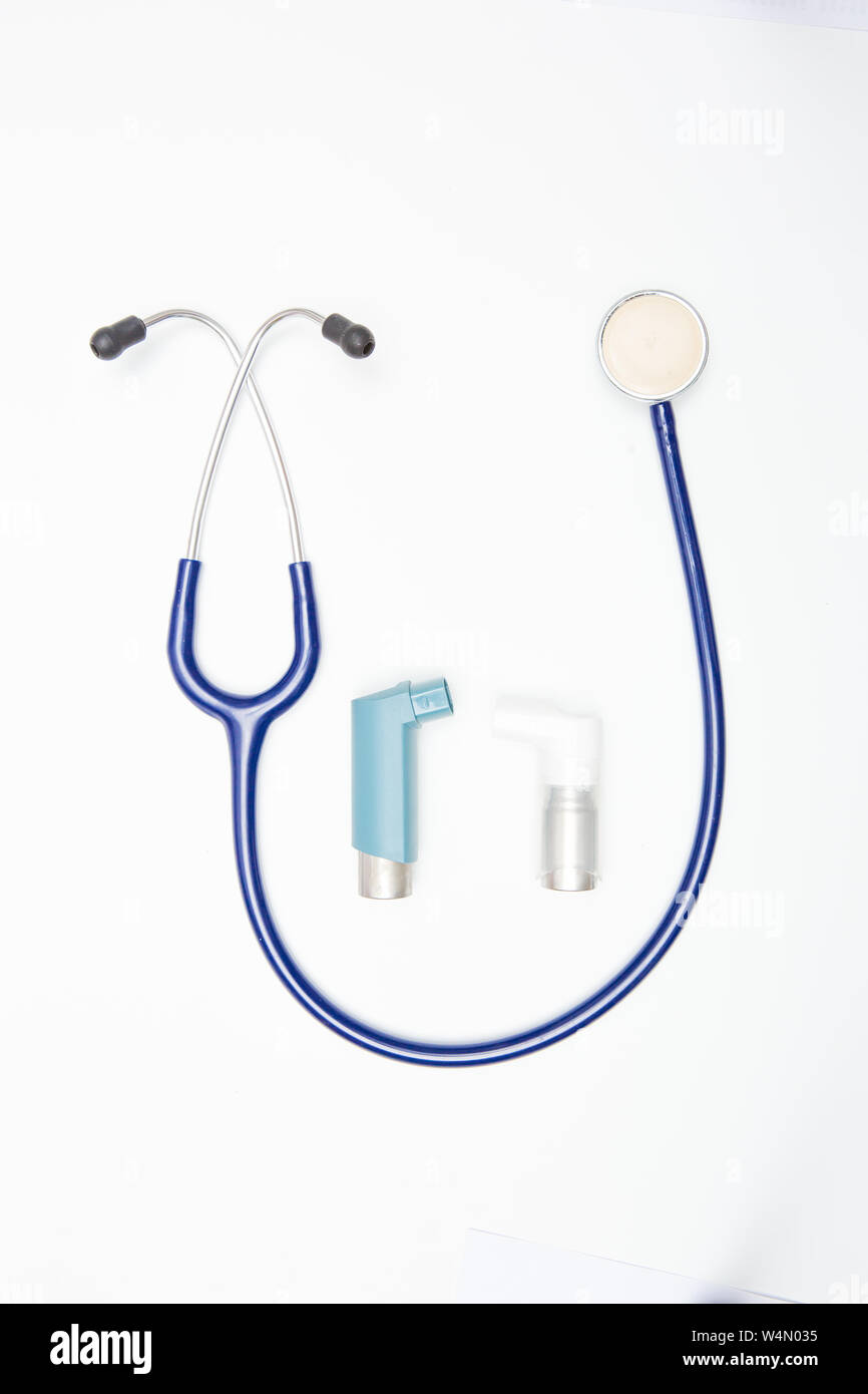 respiratory inhaler and stethoscope on white background Stock Photo - Alamy